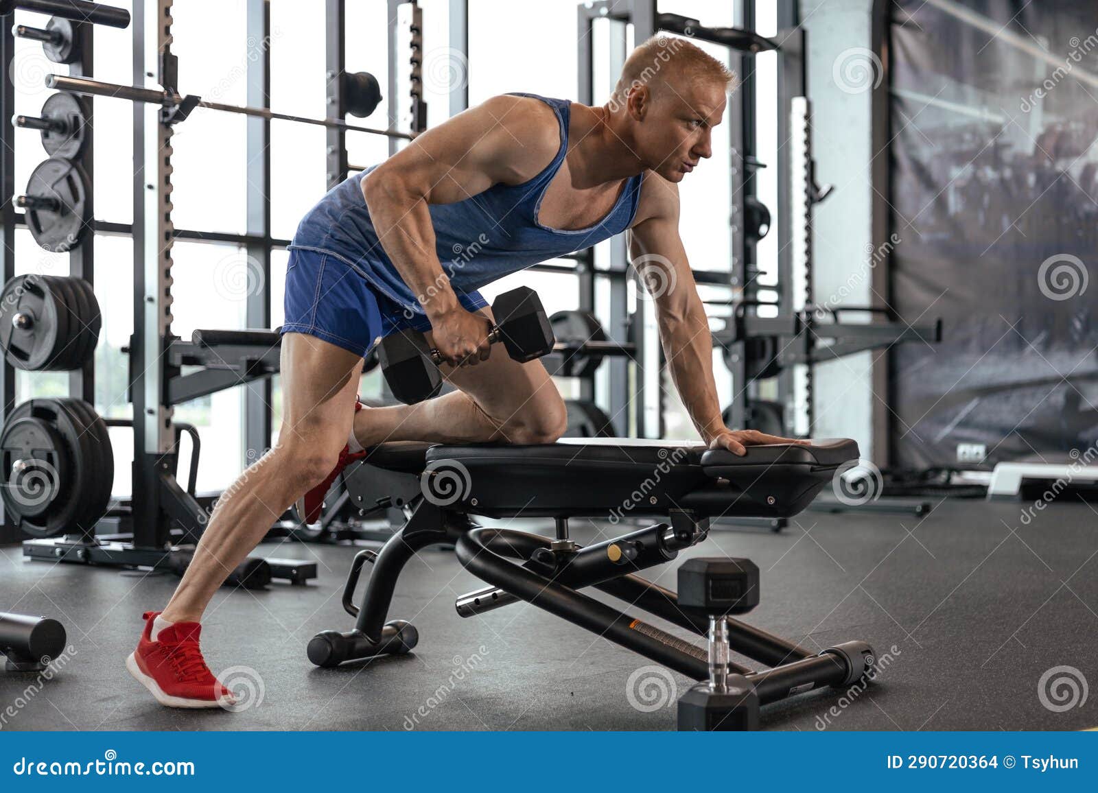 Fit and Muscular Man Trains with Dumbbells. Stock Photo - Image of ...