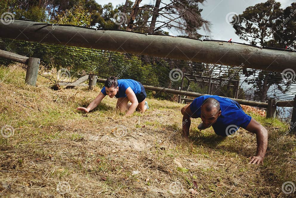 Fit People Crawling Under the Net during Obstacle Course Stock Photo ...