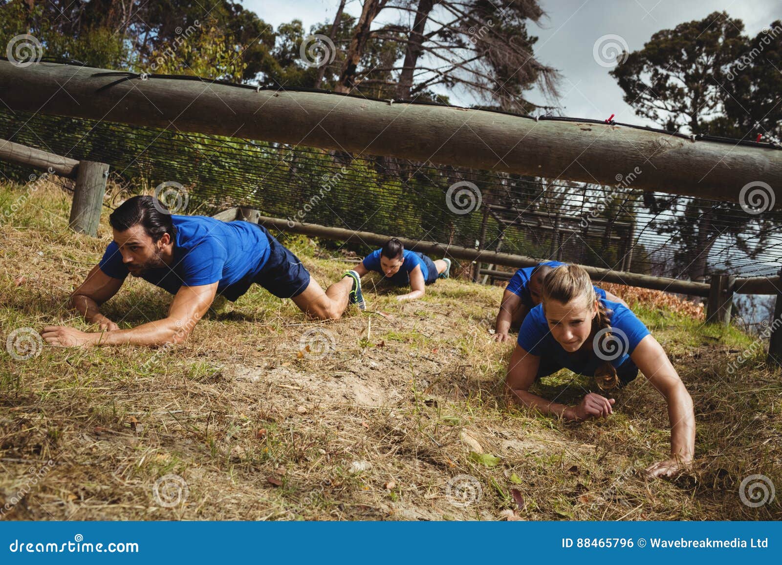 Fit People Crawling Under the Net during Obstacle Course Stock Photo ...