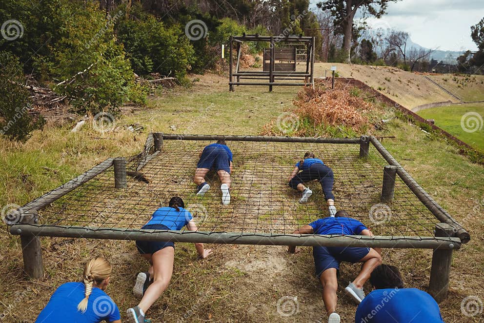 Fit People Crawling Under the Net during Obstacle Course Stock Image ...