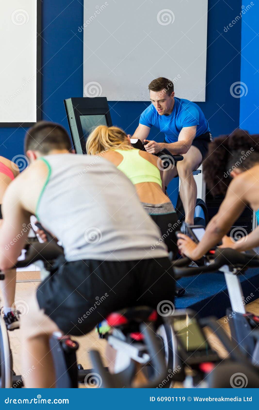 Fit people in a spin class stock image. Image of male - 60901119