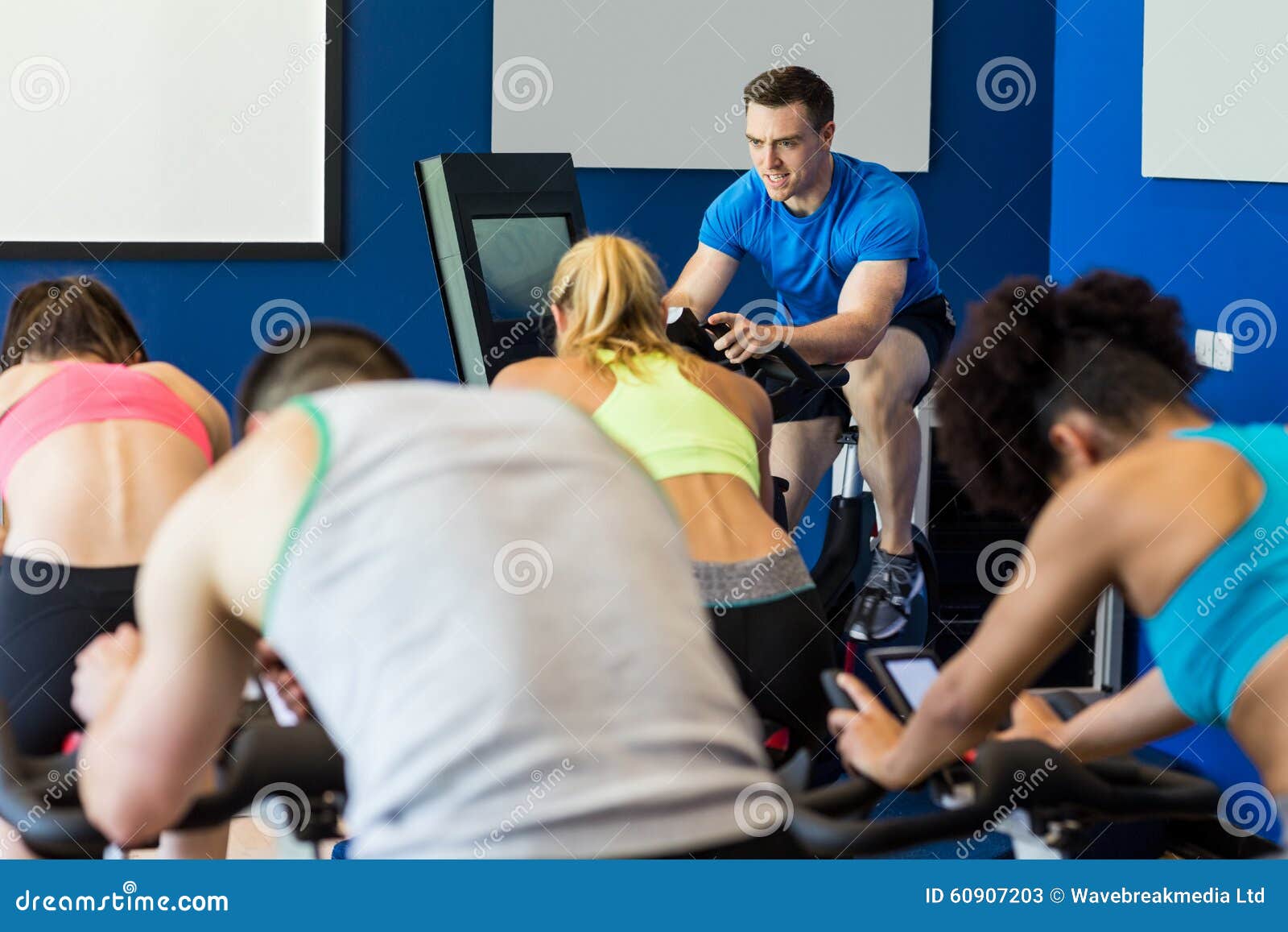 Fit people in a spin class stock image. Image of male - 60907203
