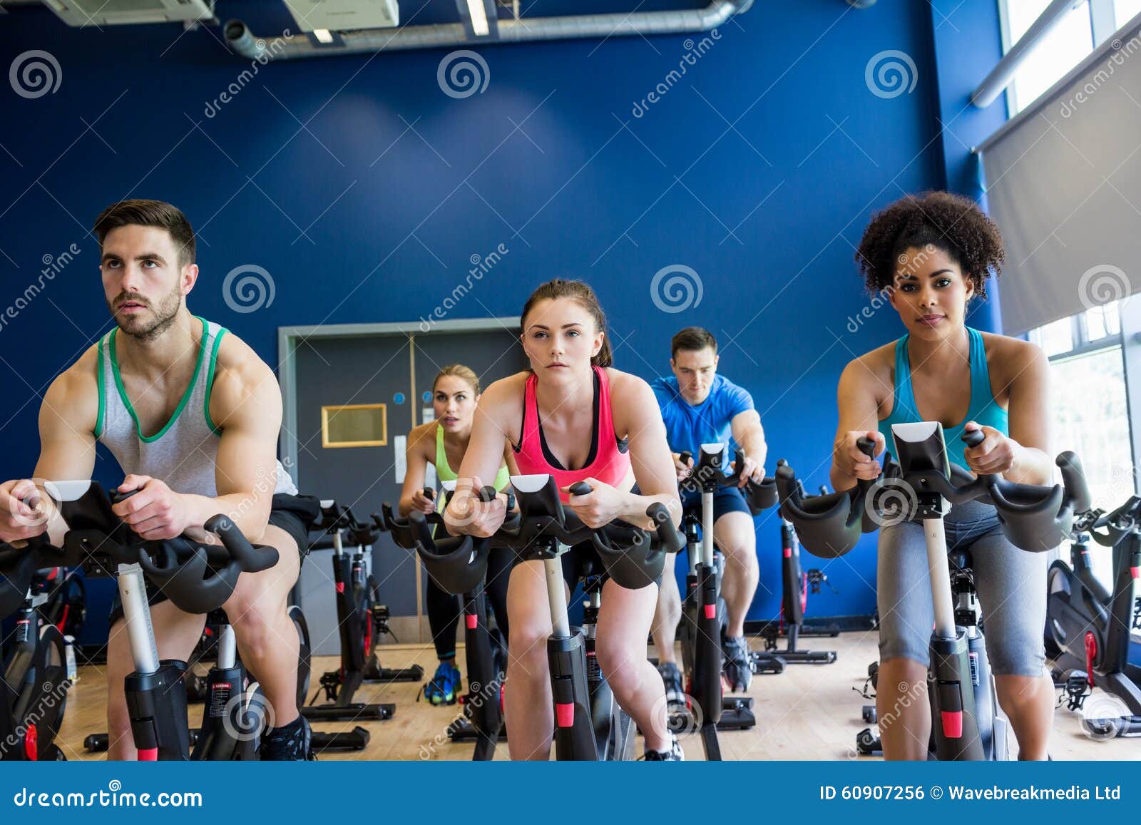 Fit people in a spin class stock photo. Image of equipment - 60907256