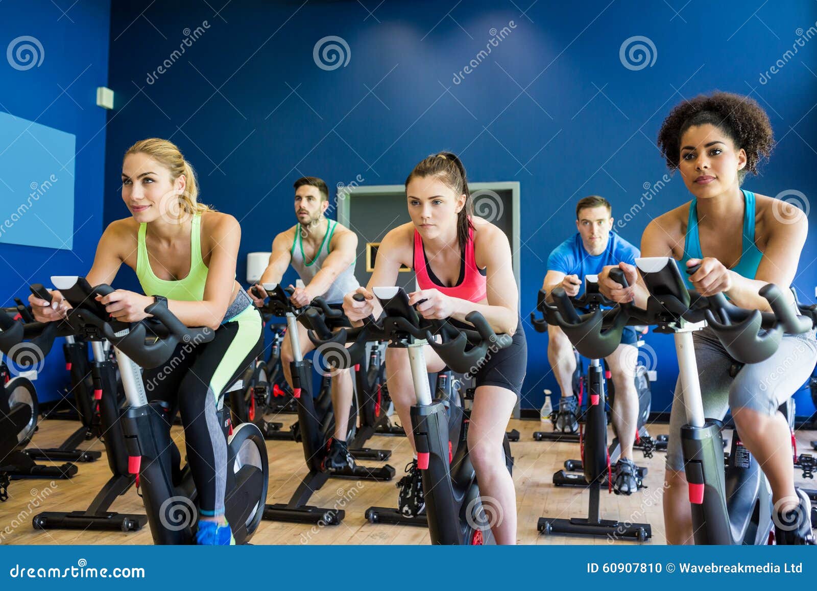 Fit people in a spin class stock photo. Image of five - 60907810