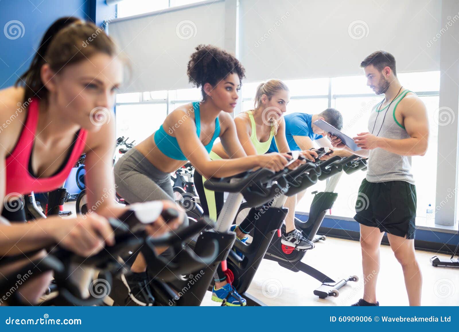Fit people in a spin class stock photo. Image of caucasian - 60909006