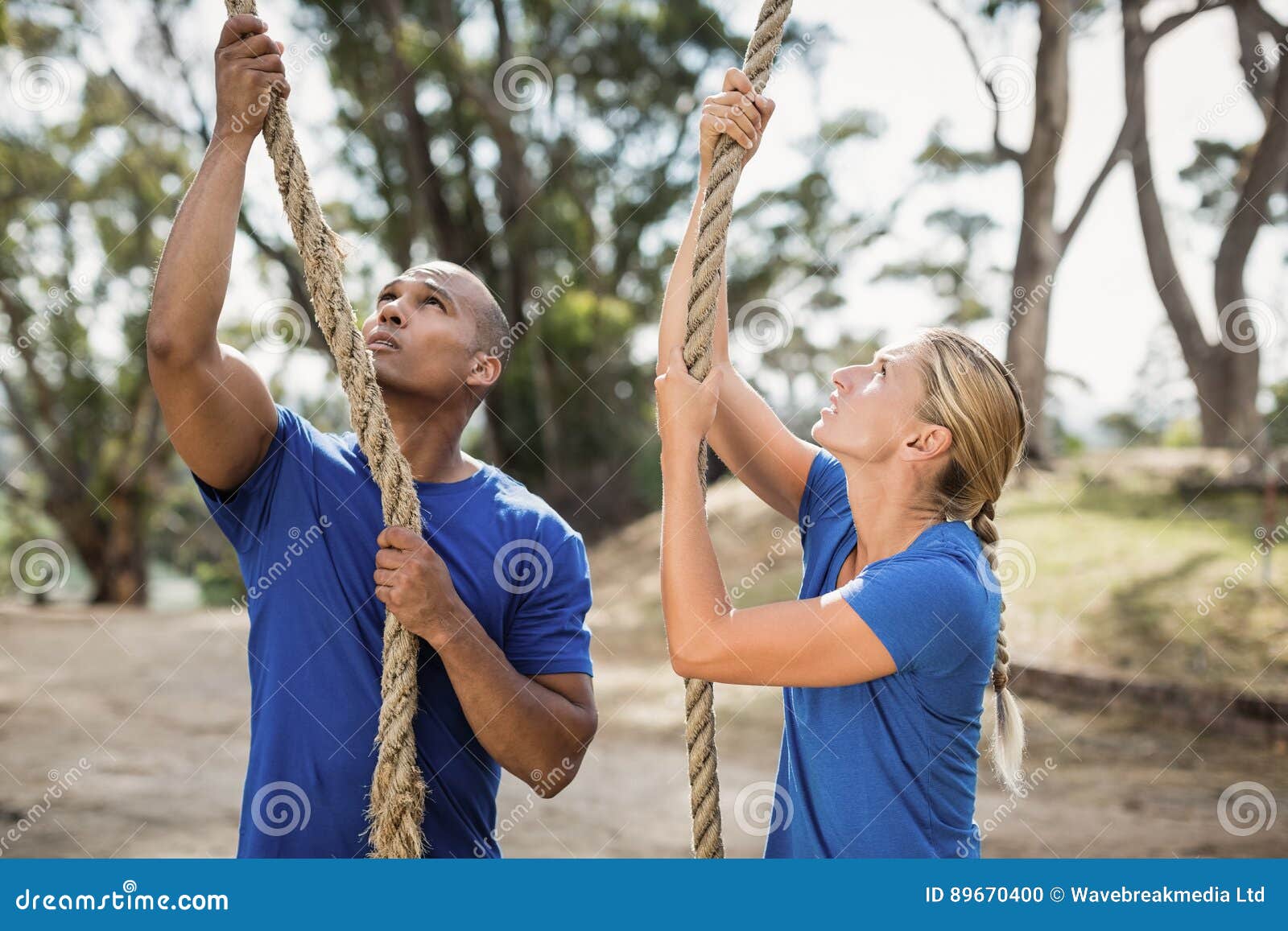 Fit Person Climbing Down the Rope during Obstacle Course Stock Photo ...