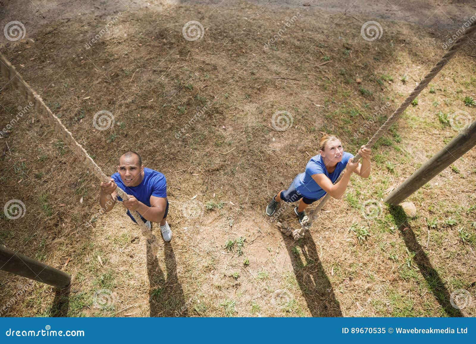 Fit Person Climbing Down the Rope during Obstacle Course Stock Image ...