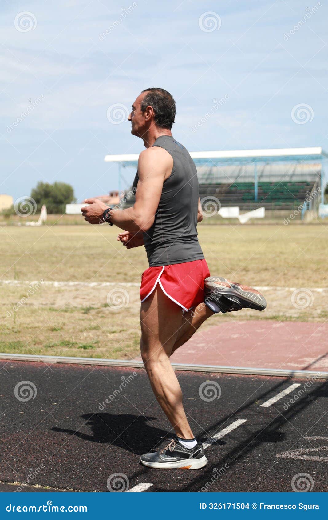 Fit Runner Sprinting on the Track Stock Photo - Image of competition ...