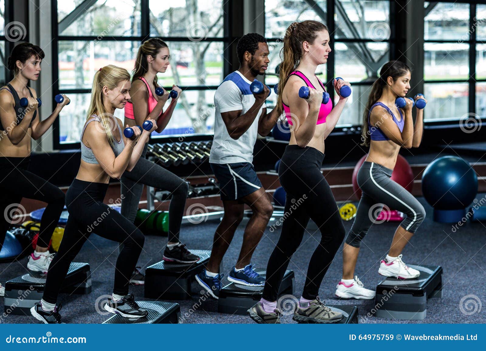 Fit Smiling Group Doing Exercise Stock Image - Image of attractive ...