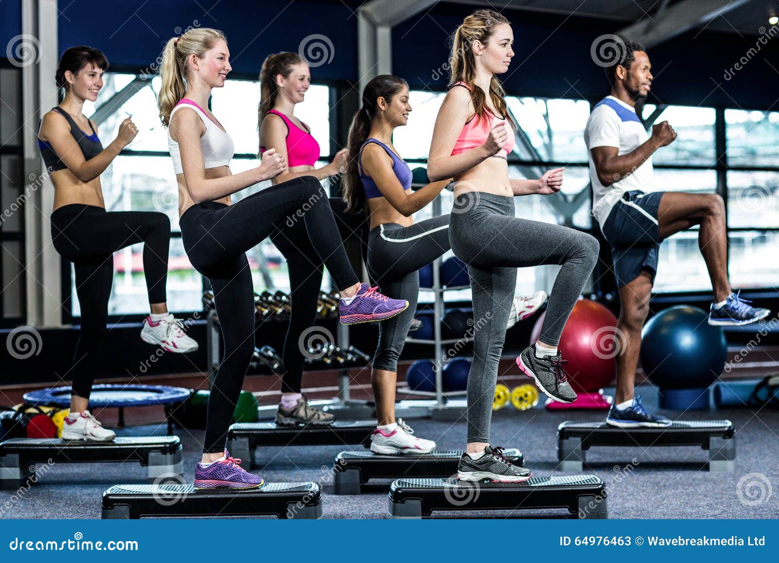 Fit Smiling Group Doing Exercise Stock Image - Image of male, adult ...