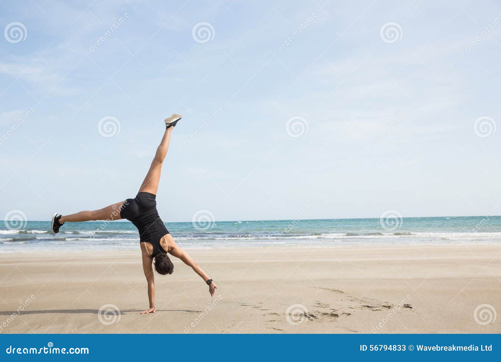 Fit Woman Cartwheeling on the Sand Stock Image - Image of fitness ...