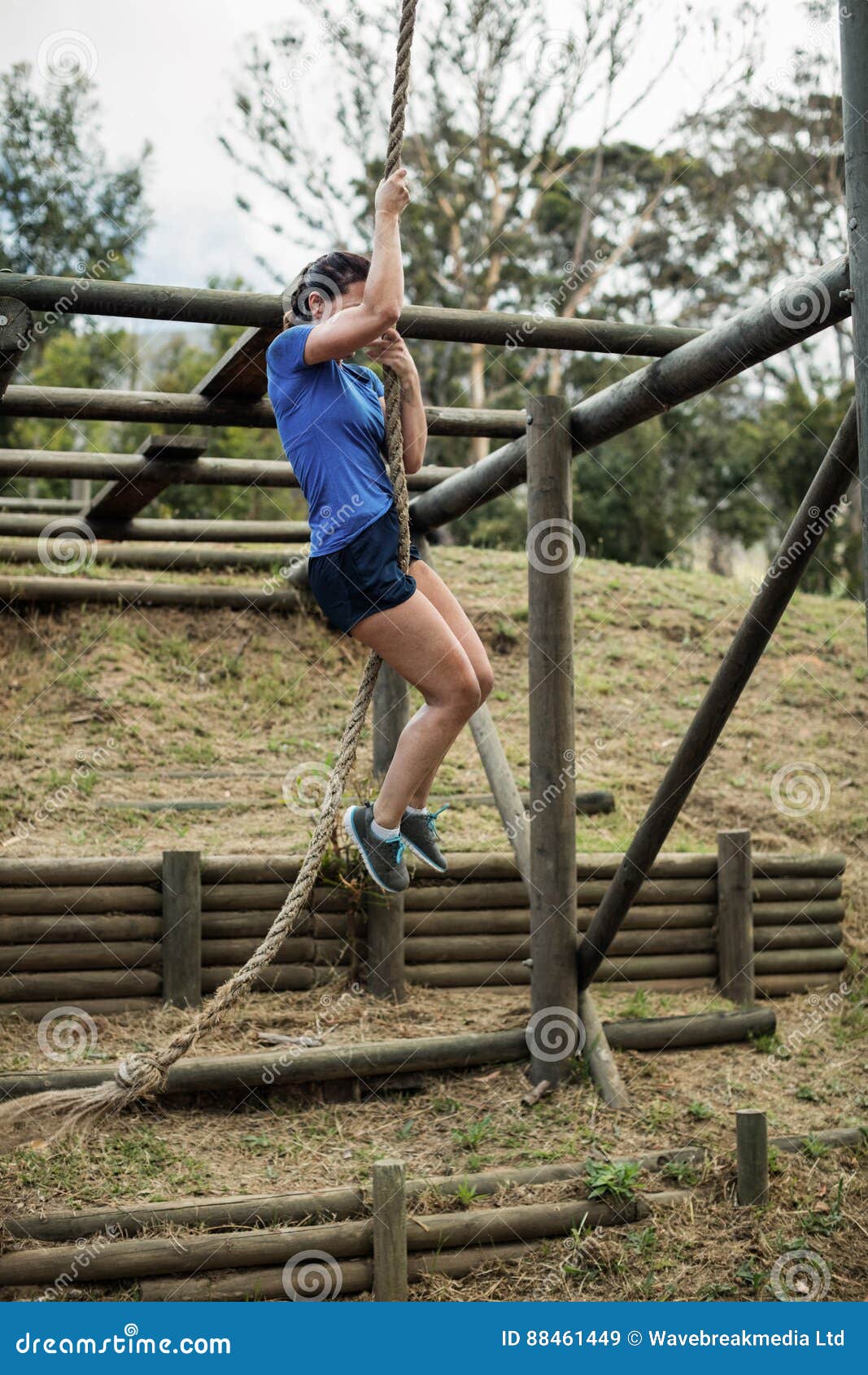 Fit Woman Climbing Down the Rope during Obstacle Course Stock Image ...