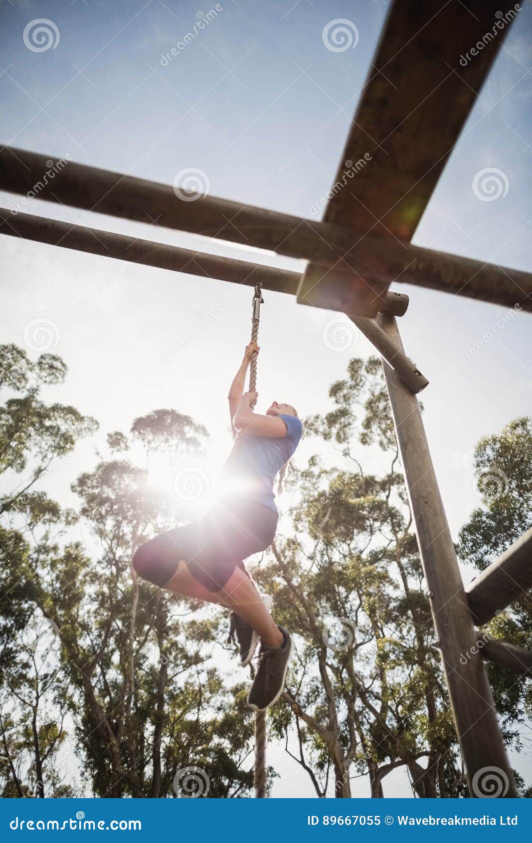 Fit Woman Climbing Down the Rope during Obstacle Course Stock Image ...