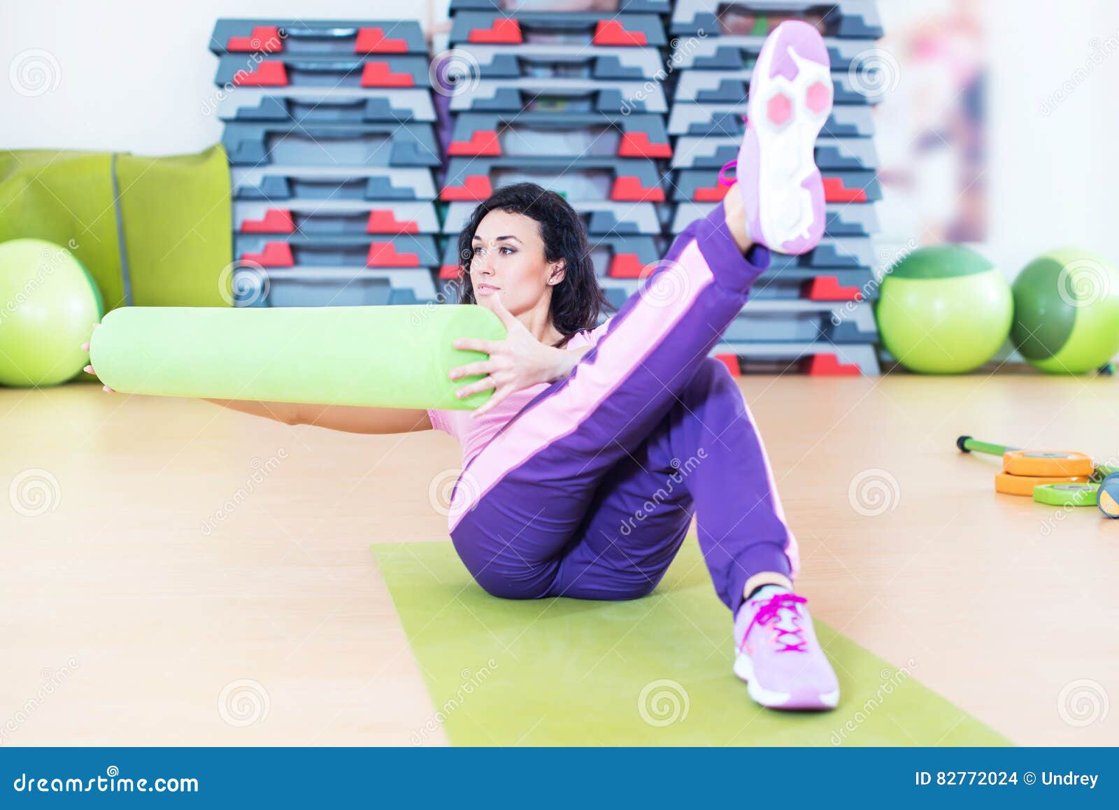 Fit Woman Doing Abs Workout Exercise Russian Twists with Raised Leg ...