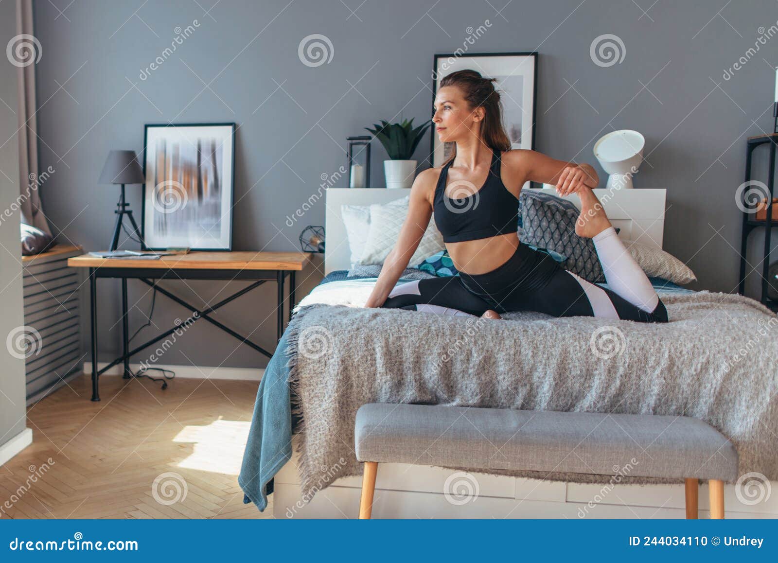 Fit Woman Doing Exercise on Bed in Bedroom Stock Photo - Image of ...