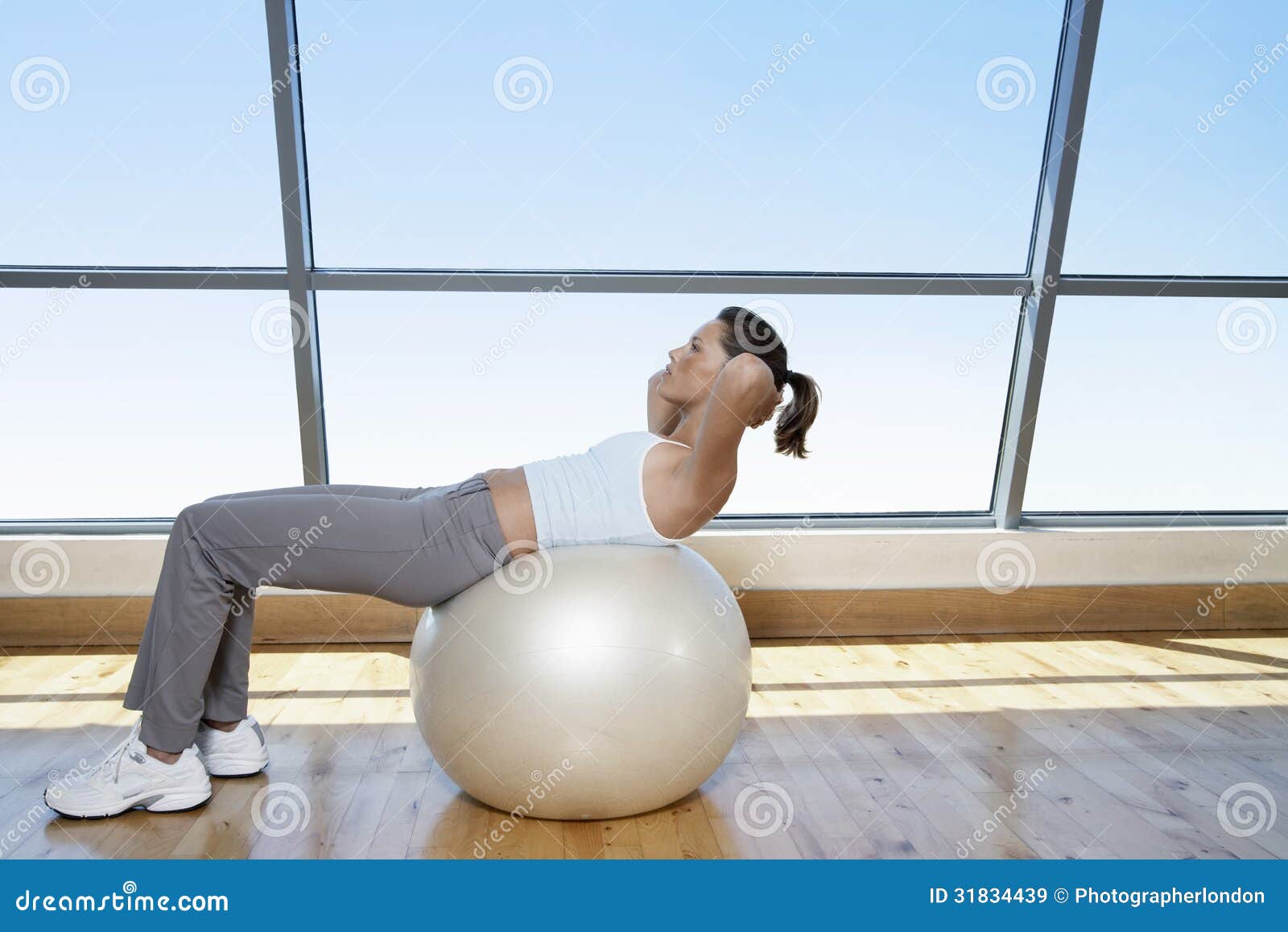 Fit Woman Doing Sit-Ups on Exercise Ball Stock Image - Image of person ...