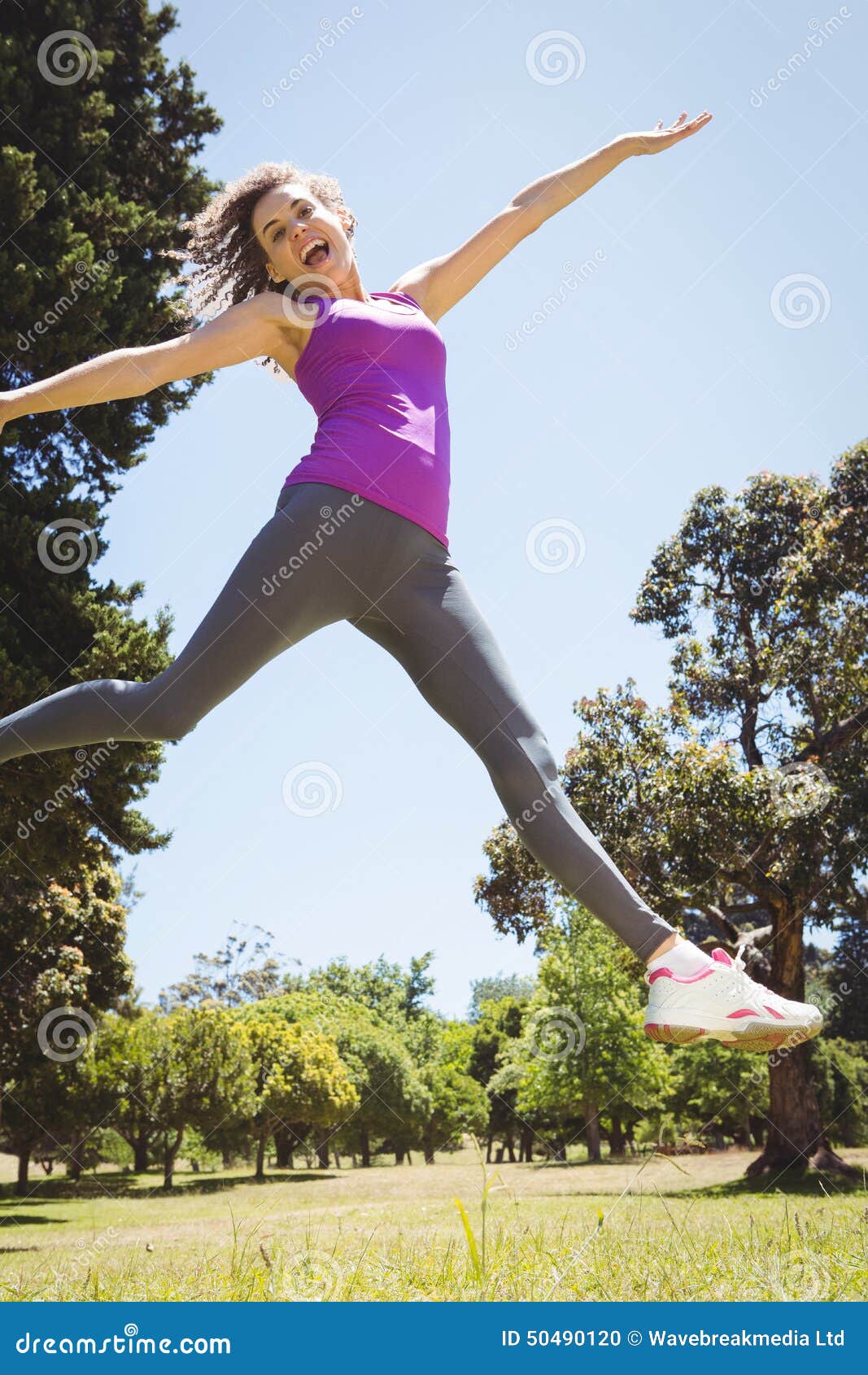 Fit Woman Leaping in the Park Stock Photo - Image of happy, body: 50490120