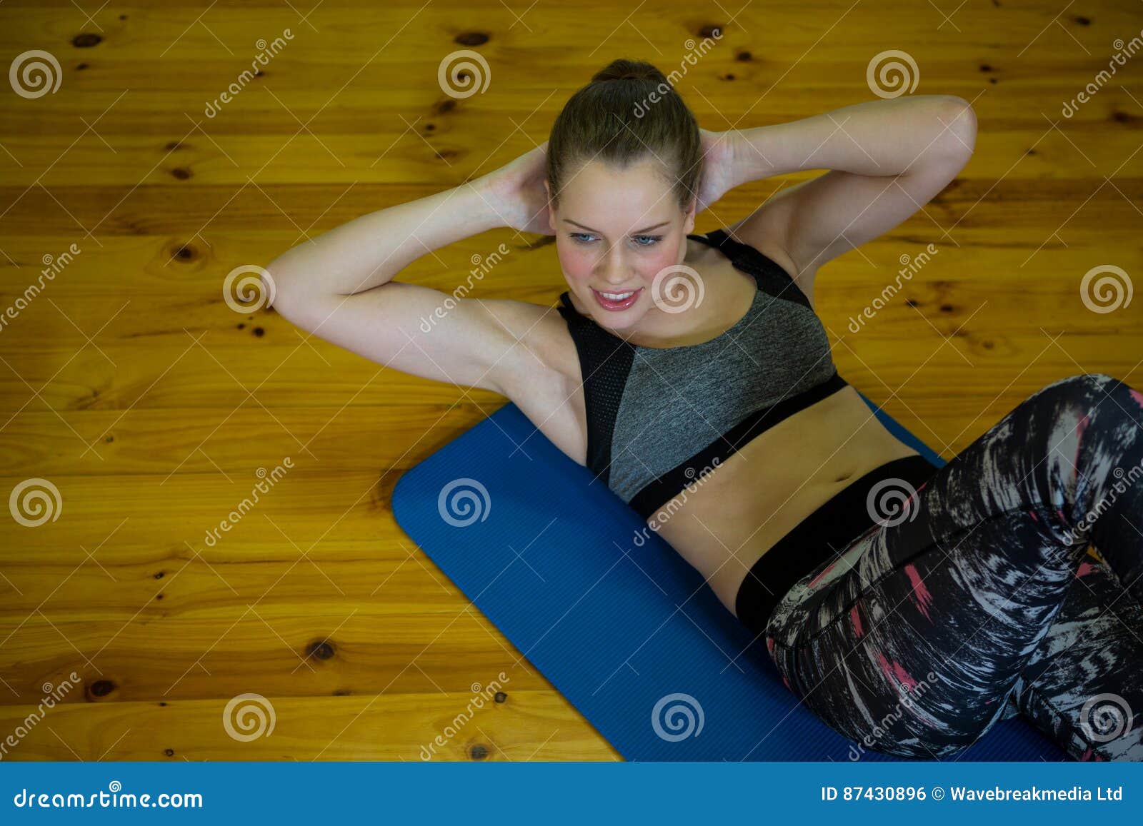 Fit Woman Performing Stretching Exercise Stock Photo - Image of effort ...