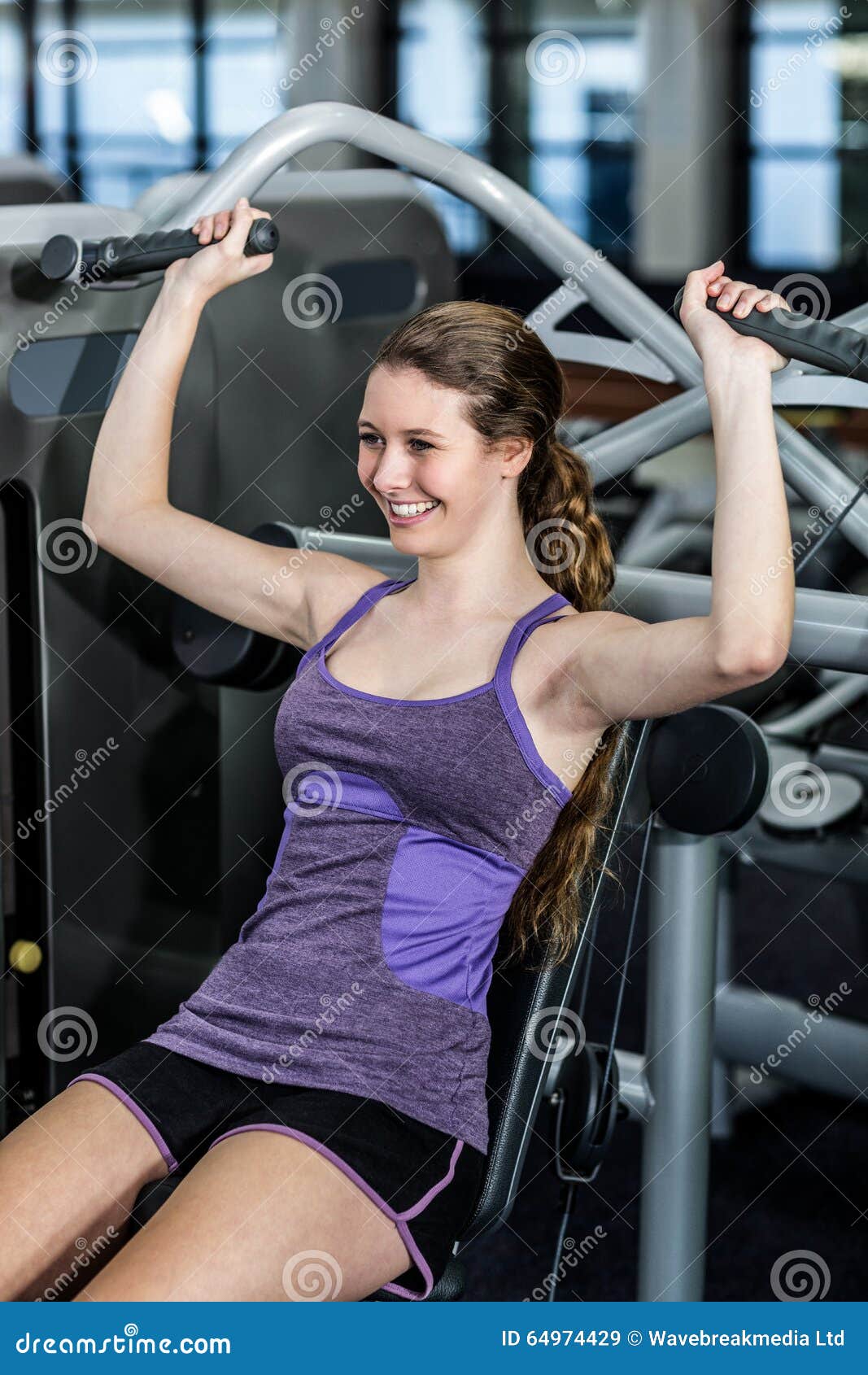 Fit Woman Using Exercise Machine Stock Image - Image of equipment ...