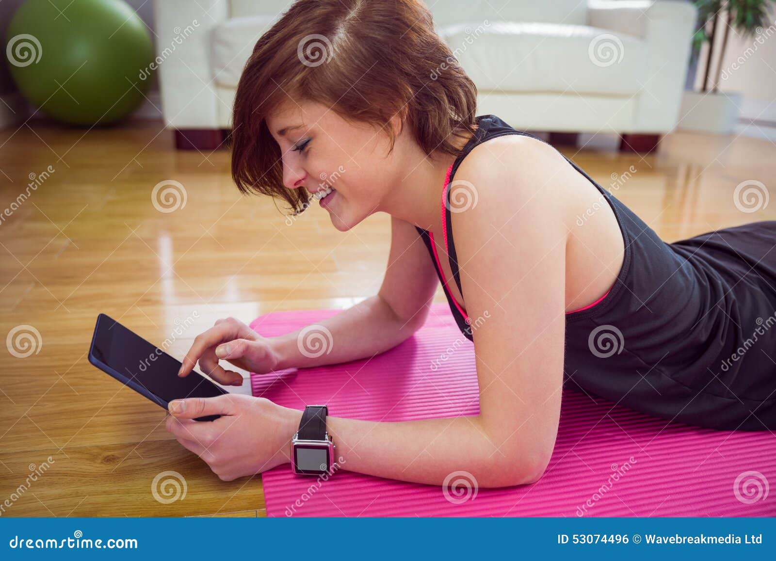 Fit Woman Using Tablet Pc on Mat Stock Photo - Image of brown, brunette ...