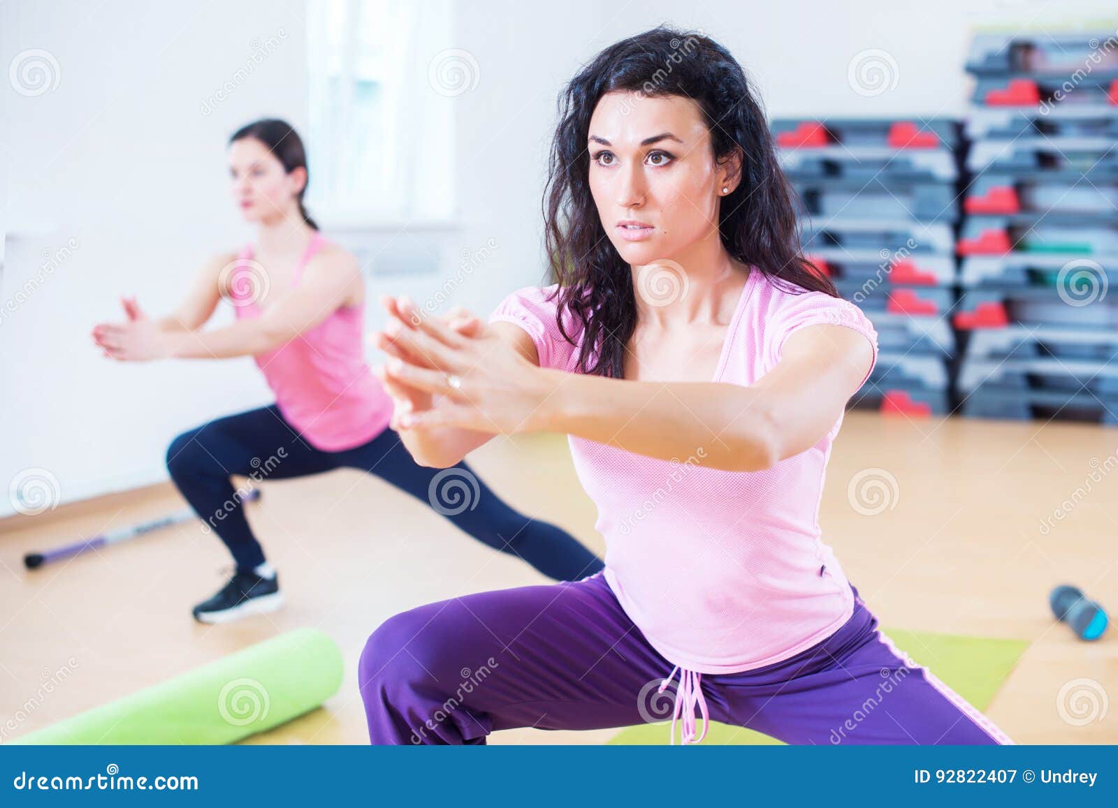 Fit Women Doing Side Lunges, Exercises for Legs, Hips and Buttocks ...