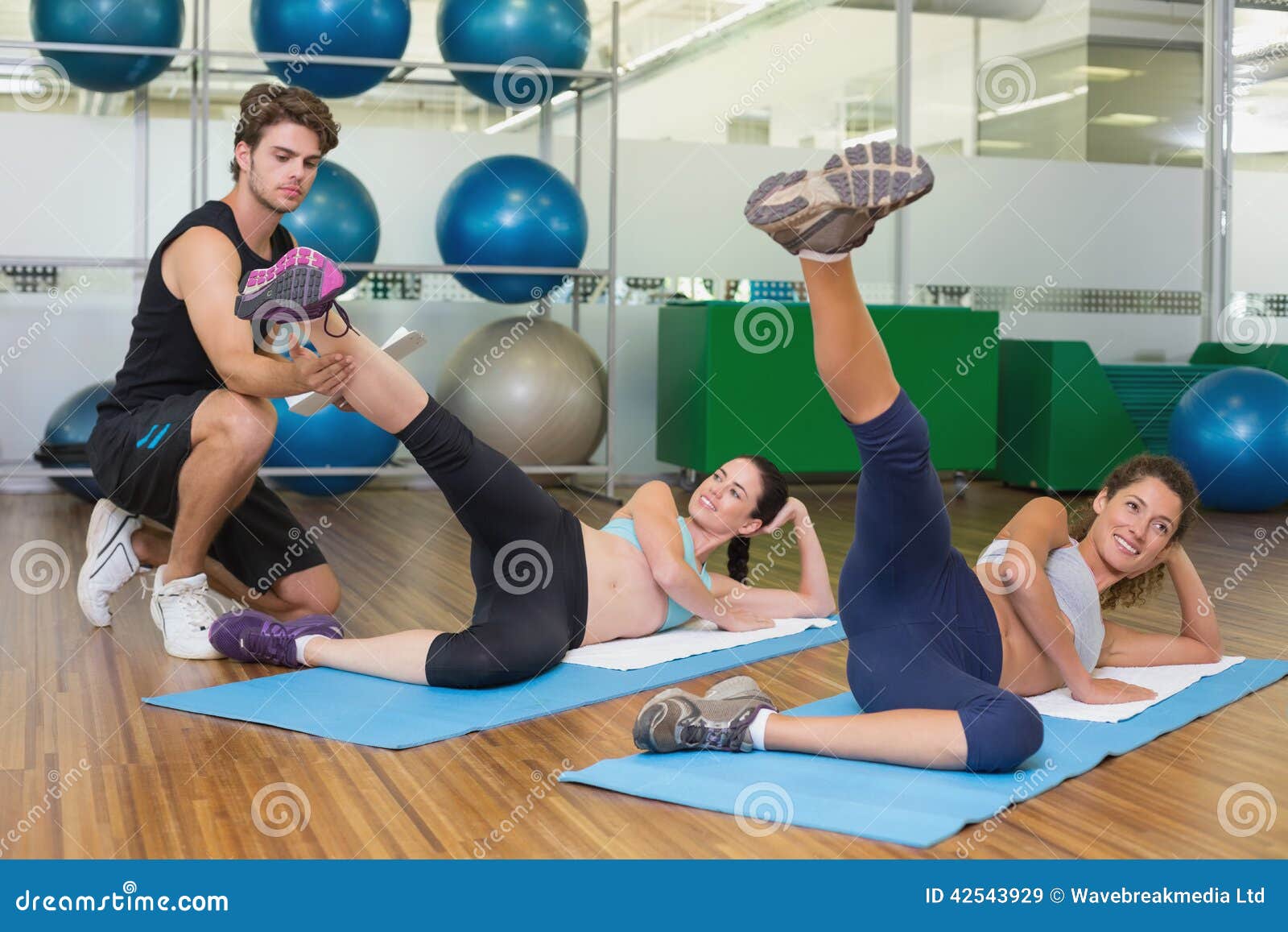 Fit Women Working Out Together in Studio with Trainer Stock Image ...