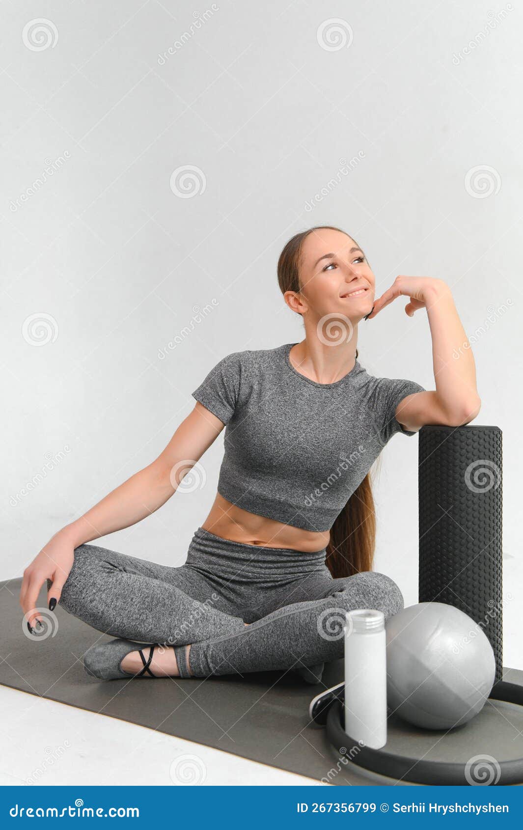Fit Young Brunette Pilates Instructor Showing Different Exercises on a ...
