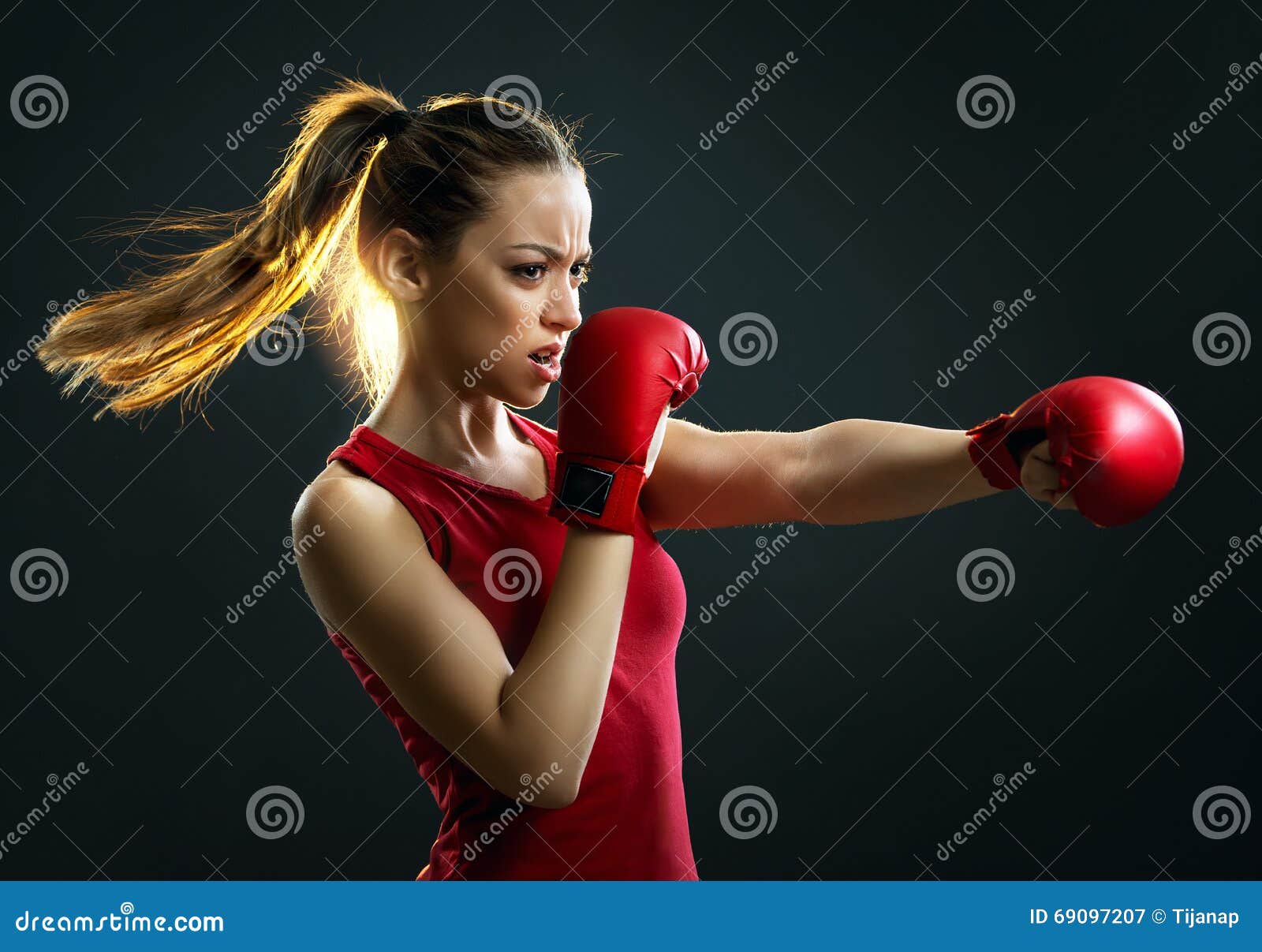 Fit, Young, Energetic Woman Boxing, Black Background Stock Image ...