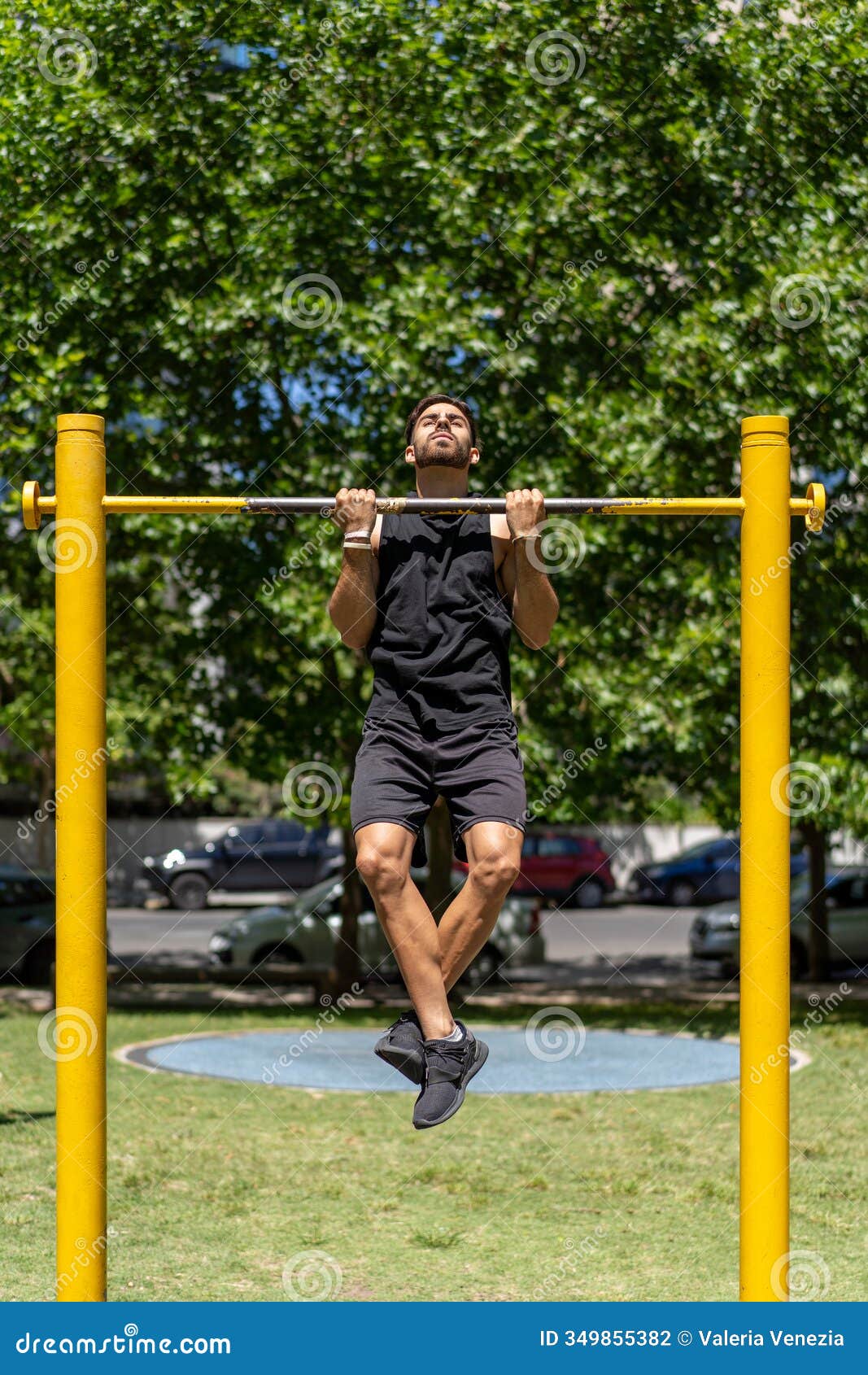 Fit Young Man Executing Pull-ups in a Park Setting Stock Photo - Image ...