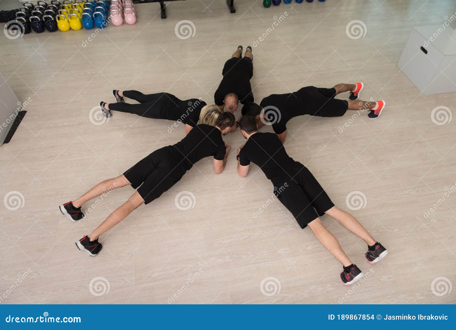 Fit People Planking in a Circle in Gym Stock Photo - Image of warmup ...