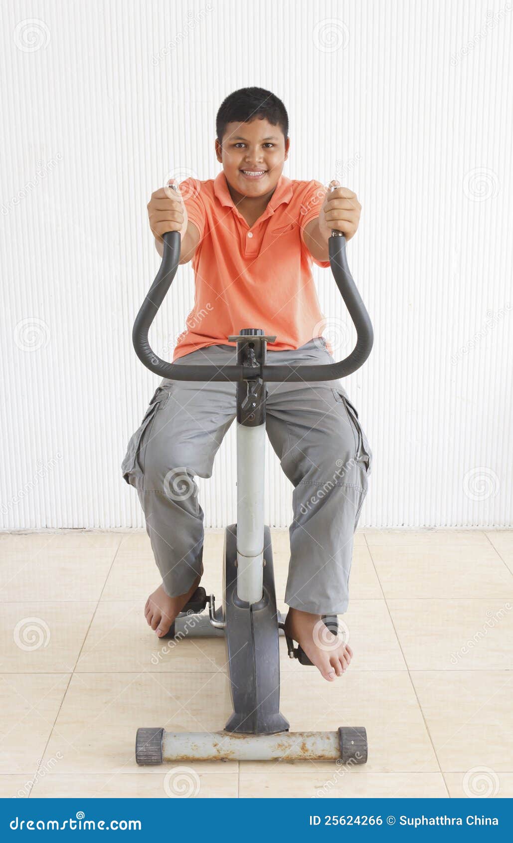 Fitness Boy on Exercise Bike Stock Photo - Image of club, bike: 25624266