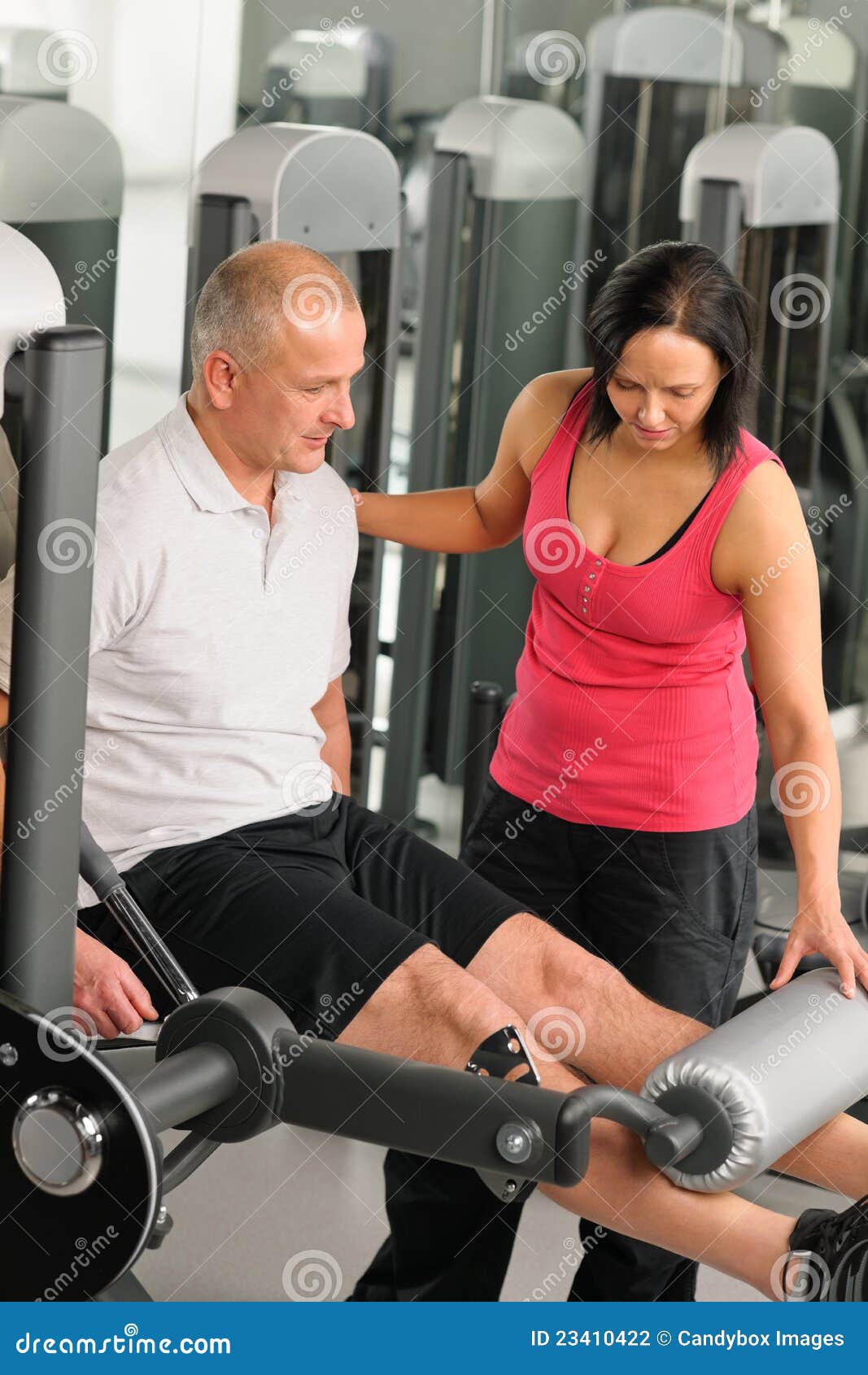 Fitness Center Active Man Exercising with Trainer Stock Photo - Image ...