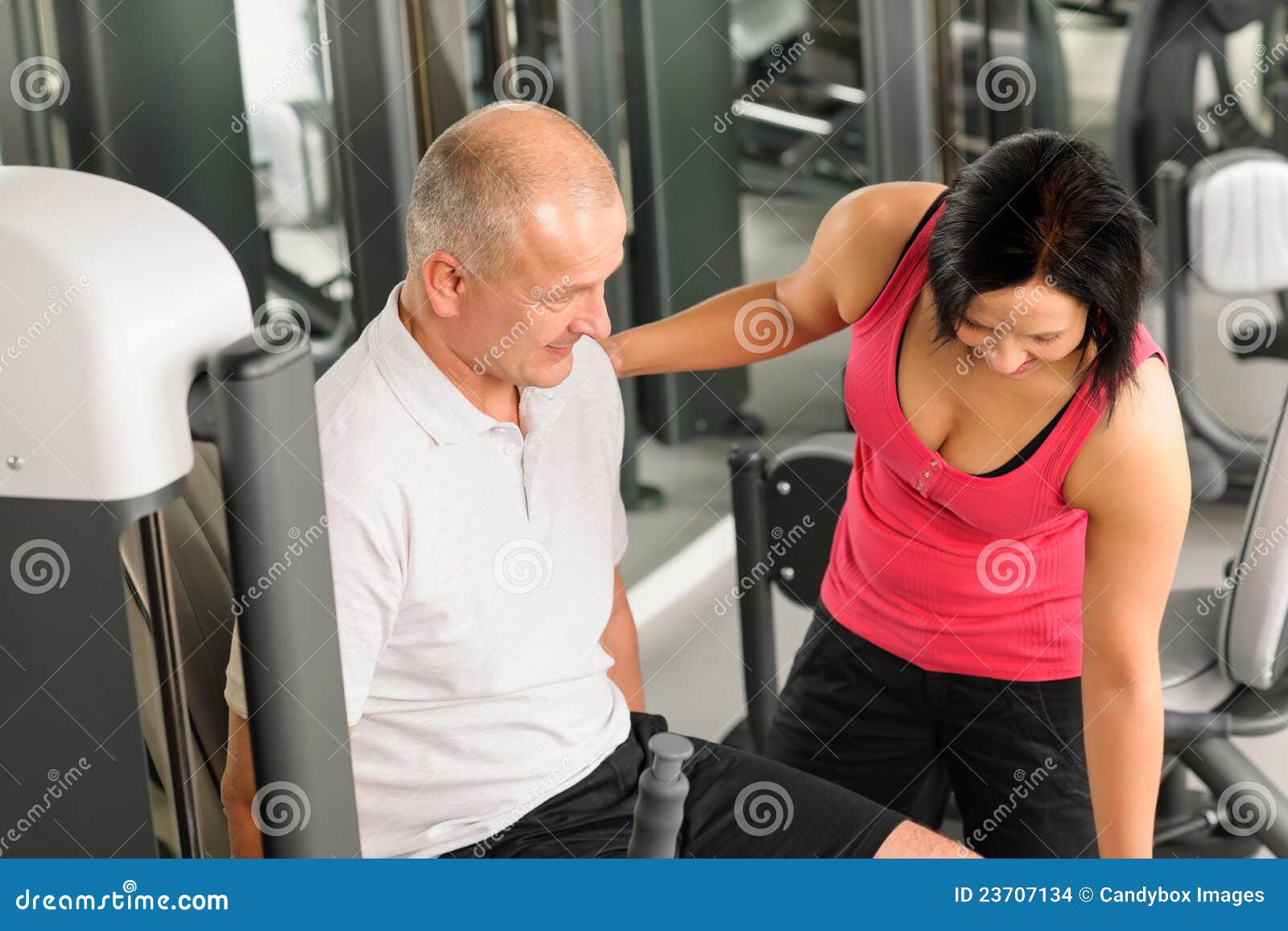 Fitness Center Active Man Exercising with Trainer Stock Photo - Image ...