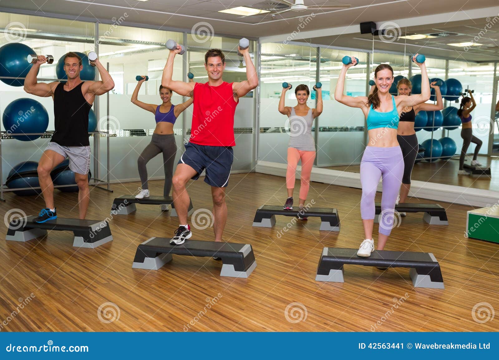 Fitness Class Doing Step Aerobics with Dumbbells Stock Image - Image of ...