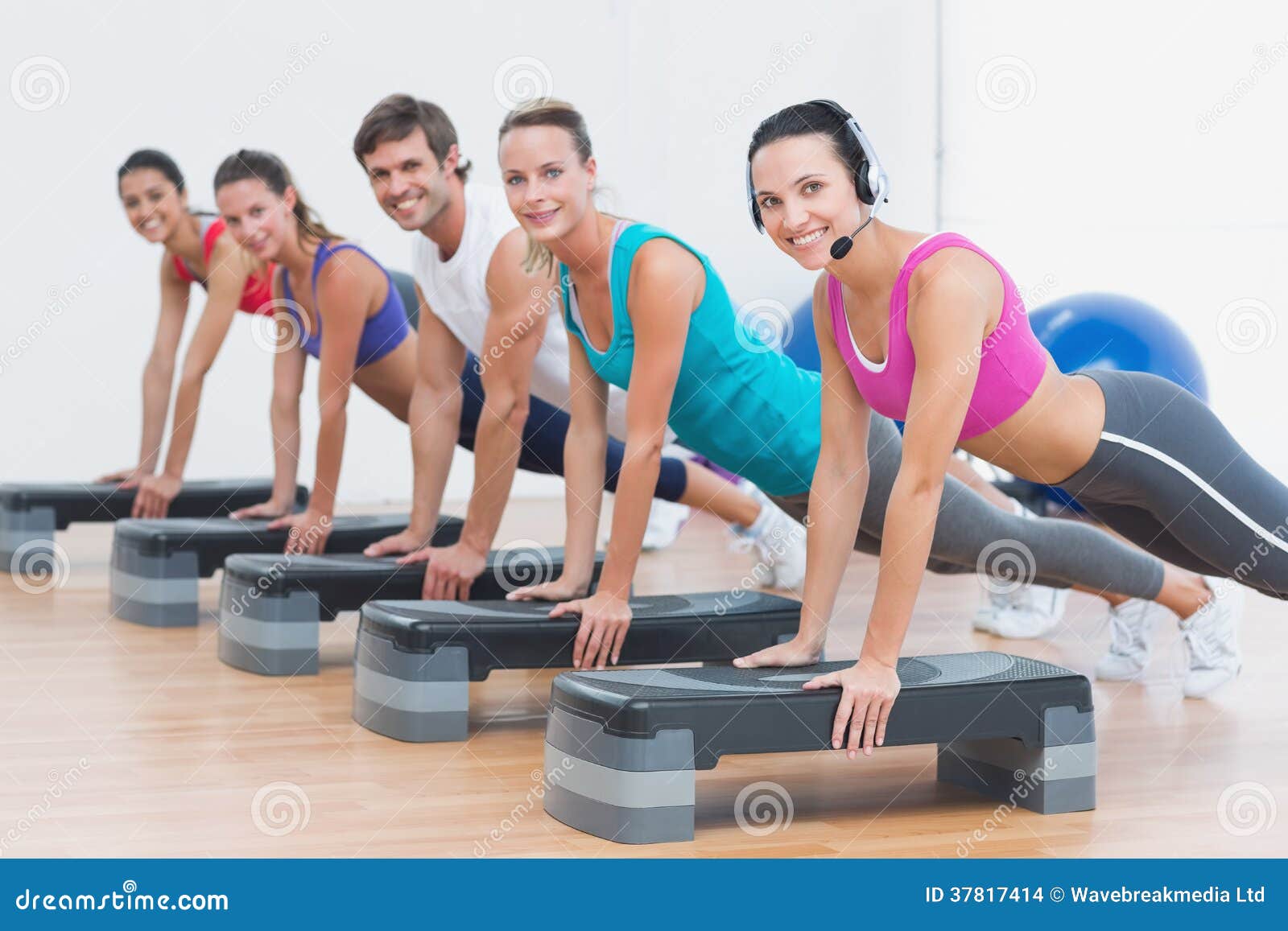 Fitness Class Doing Step Aerobics Exercise Stock Photo - Image of ...