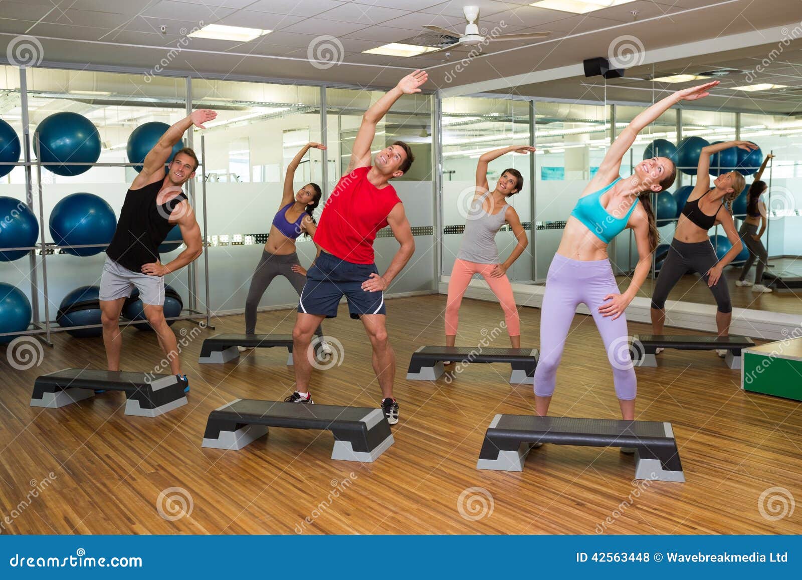 Fitness Class Doing Step Aerobics Stock Photo - Image of leisure ...