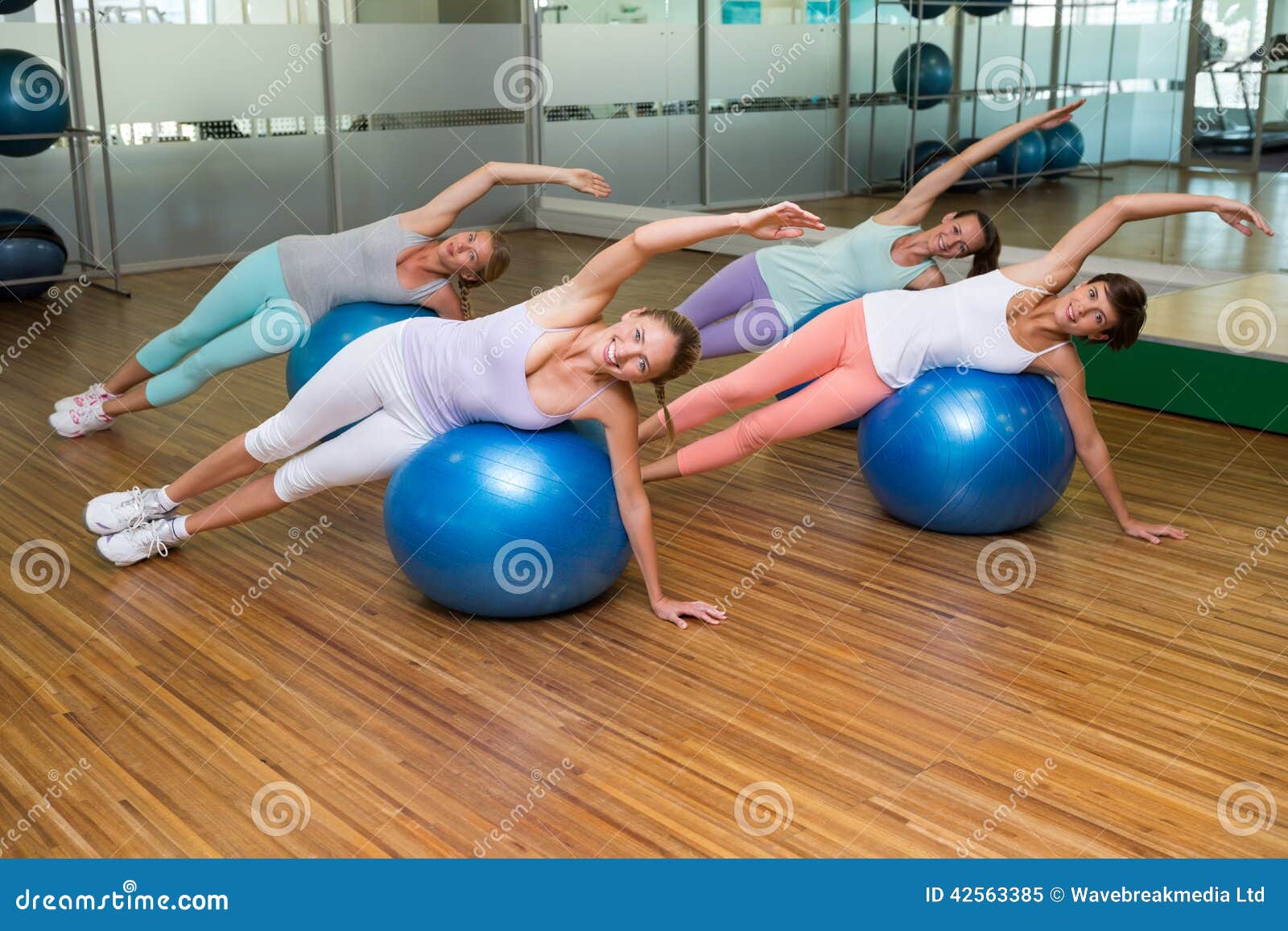 Fitness Class on Exercise Balls in Studio Stock Image - Image of ...