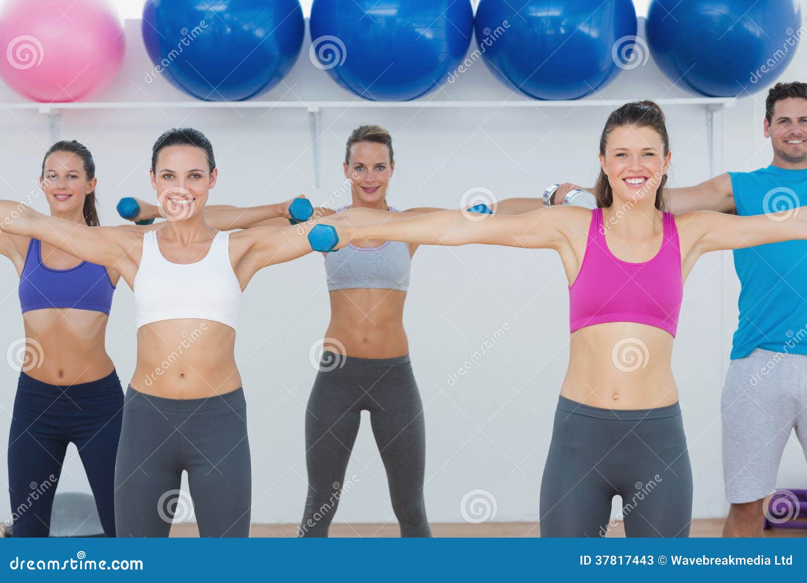 Fitness Class Exercising with Dumbbells in Gym Stock Image - Image of ...