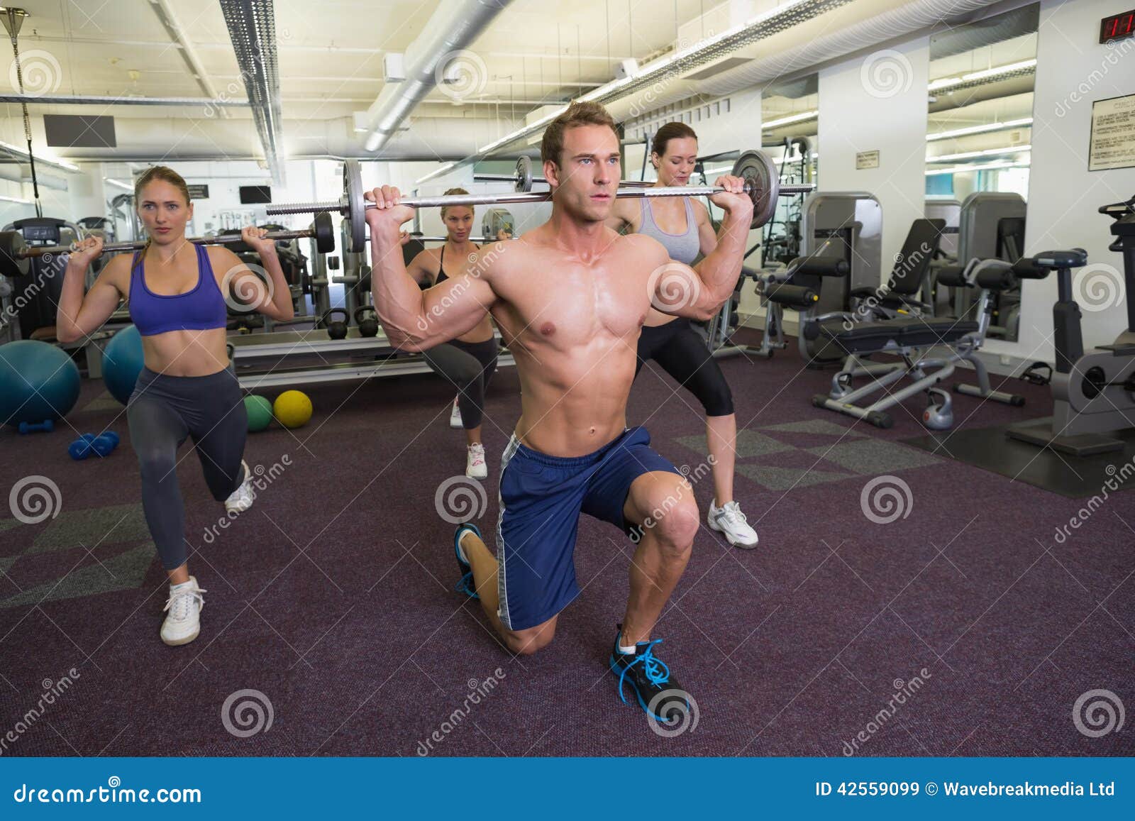 Fitness Class Lifting Barbells Together Stock Image - Image of female ...