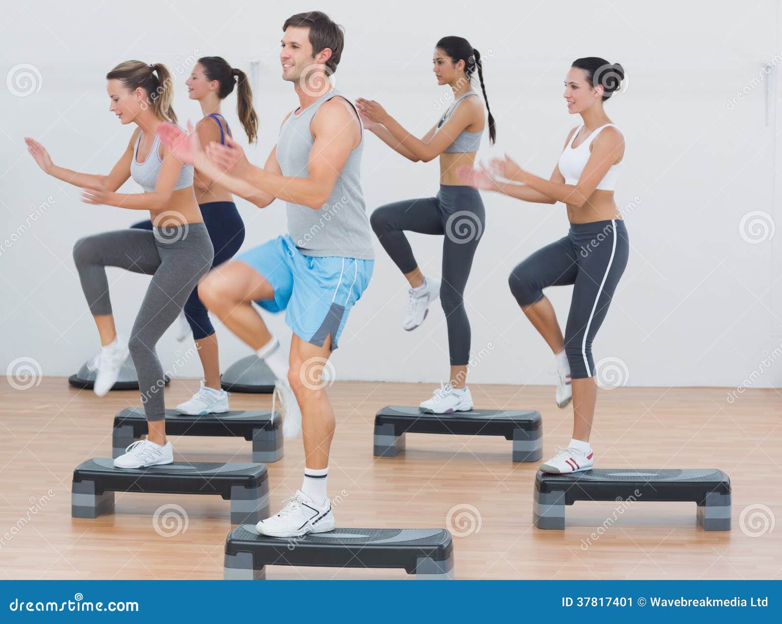 Fitness Class Performing Step Aerobics Exercise Stock Image - Image of ...