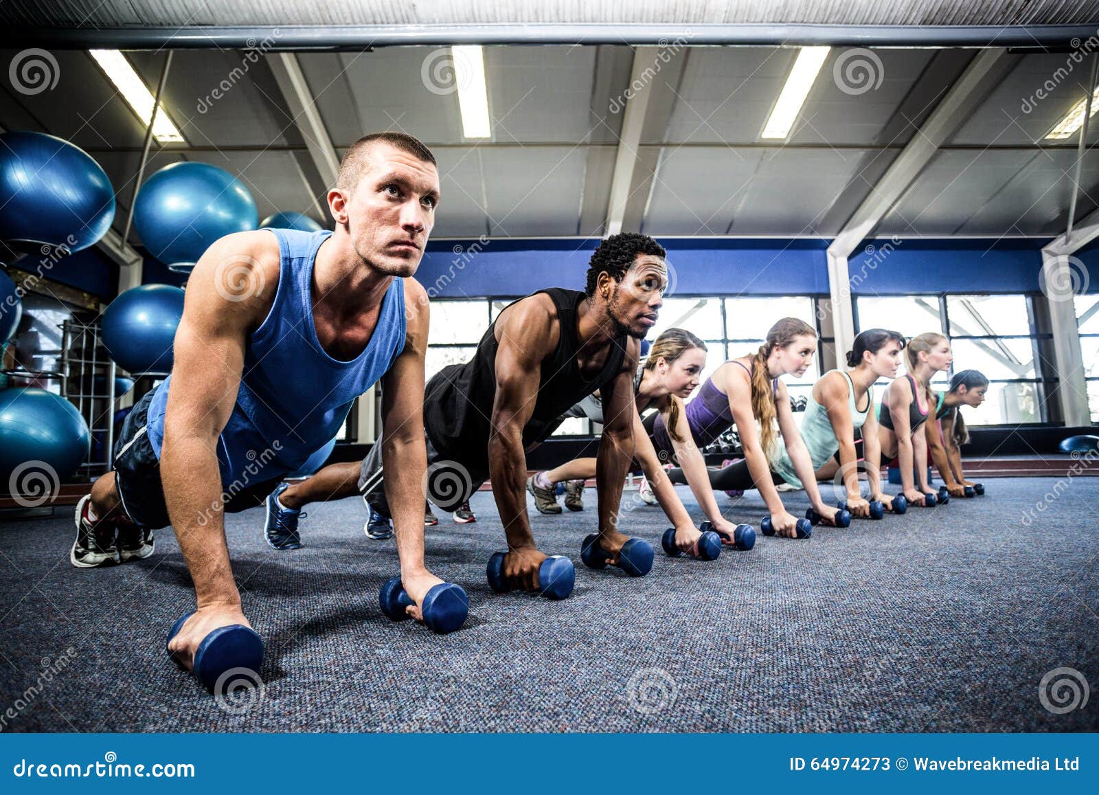 Fitness Class in Plank Position with Dumbbells Stock Image - Image of ...