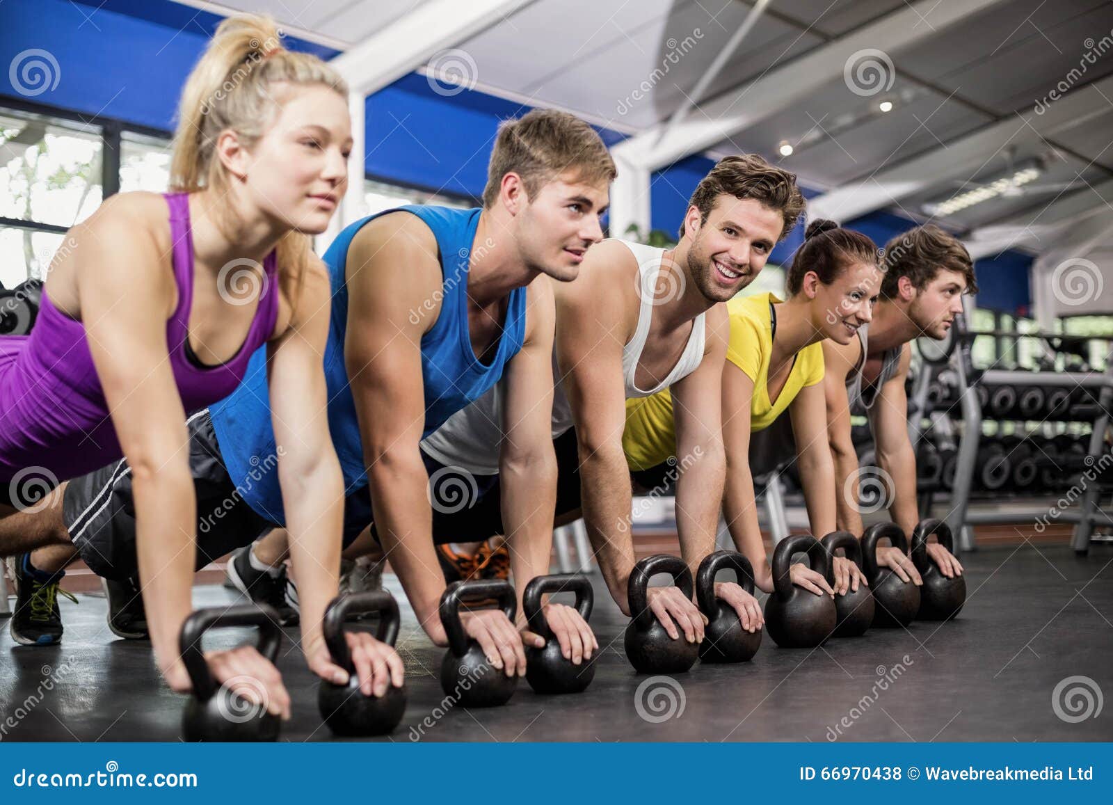 Fitness Class in Plank Position with Dumbbells Stock Photo - Image of ...