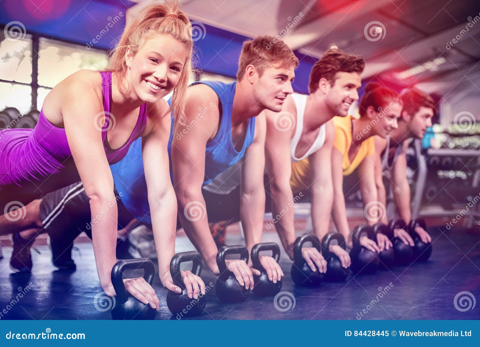 Fitness Class in Plank Position with Dumbbells Stock Image - Image of ...