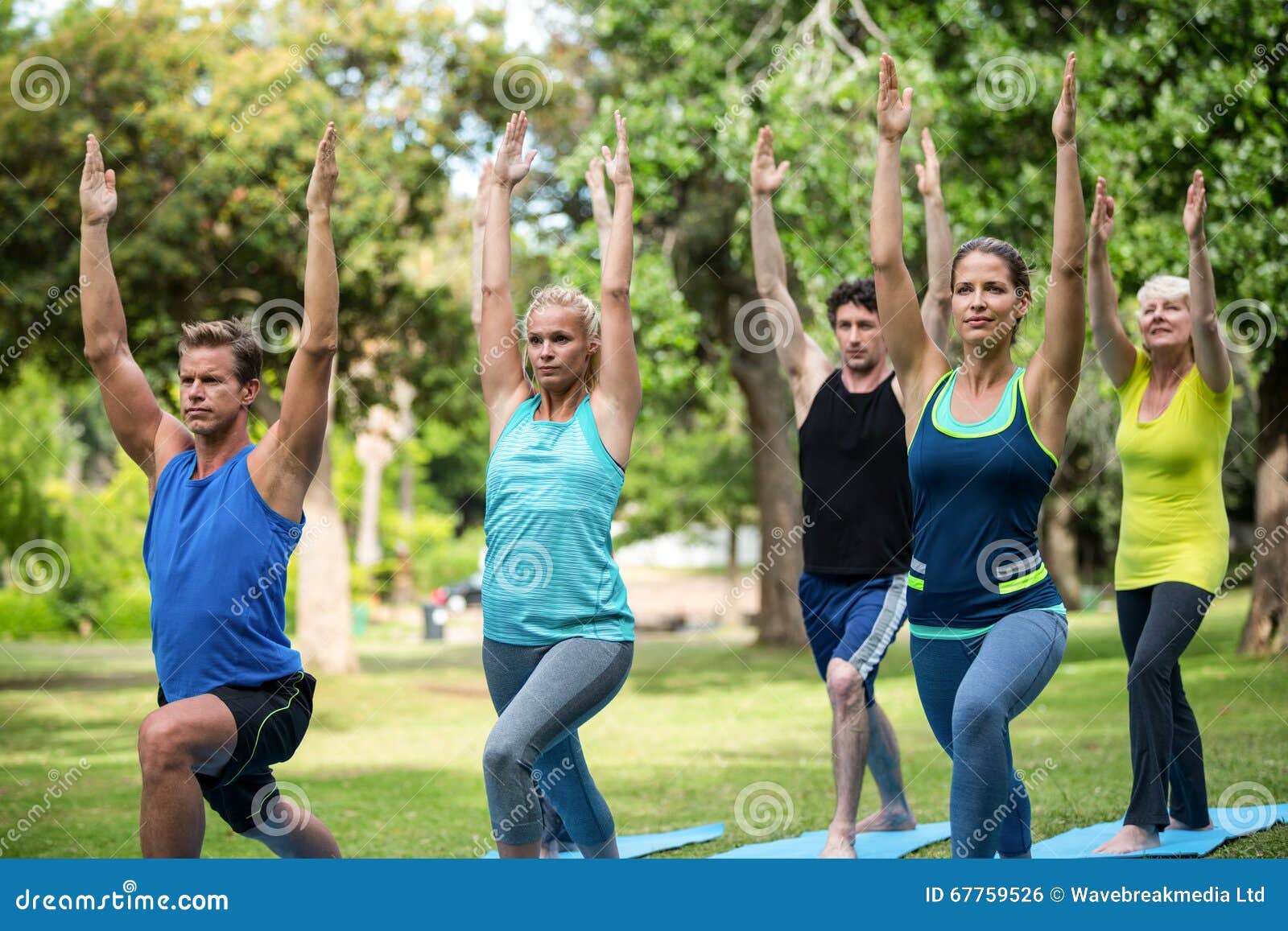 Fitness class stretching stock photo. Image of grassland - 67759526