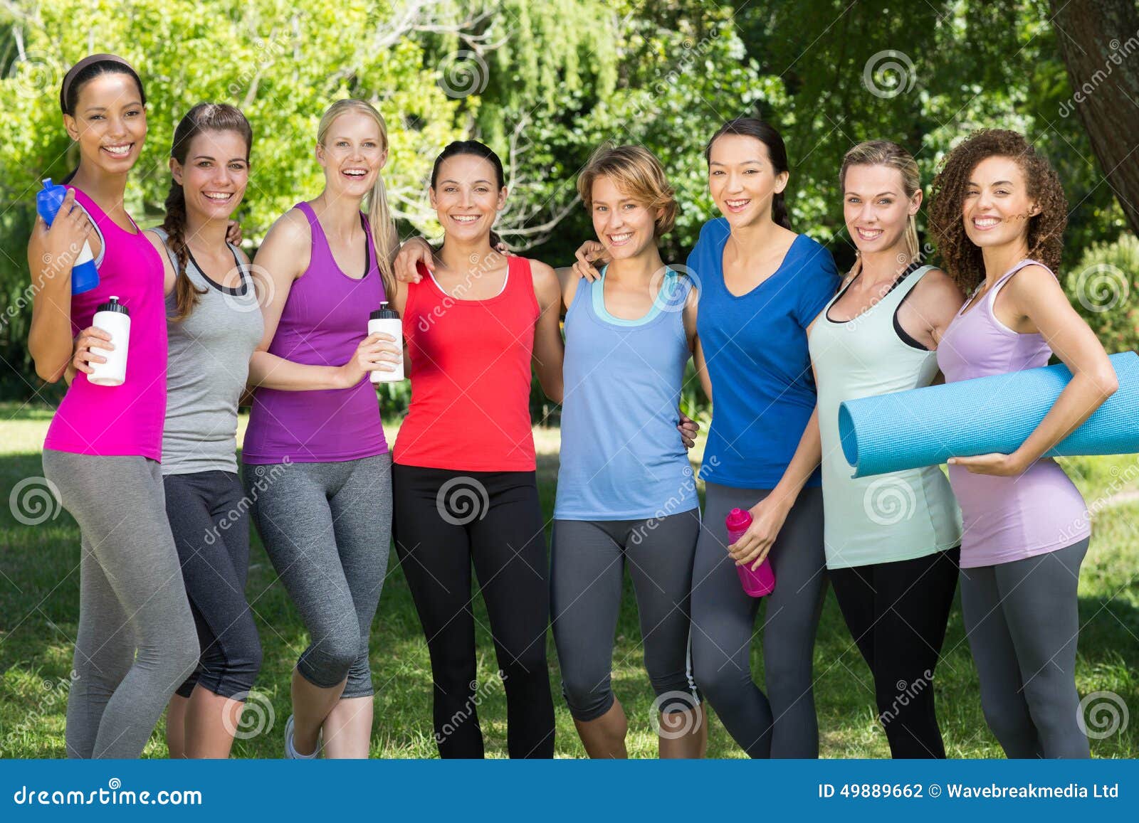 Fitness Group Smiling at Camera in Park Stock Photo - Image of ...
