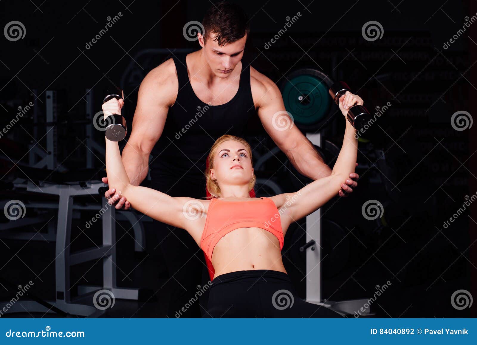 Fitness Instructor Exercising with His Client at the Gym. Stock Photo ...