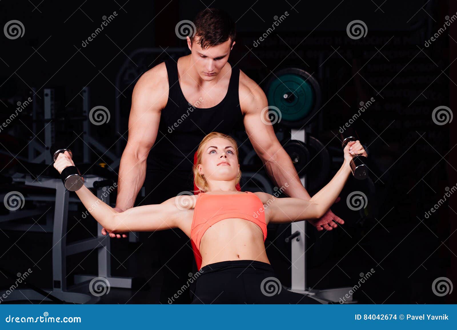 Fitness Instructor Exercising with His Client at the Gym. Stock Photo ...