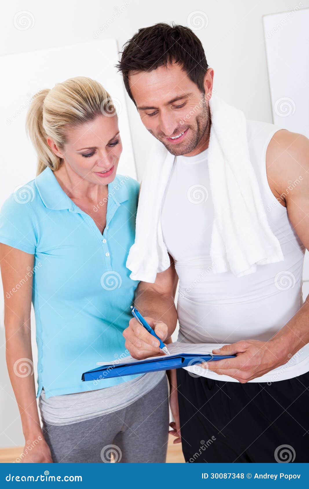 Fitness Instructor Taking Notes after a Session Stock Photo - Image of ...
