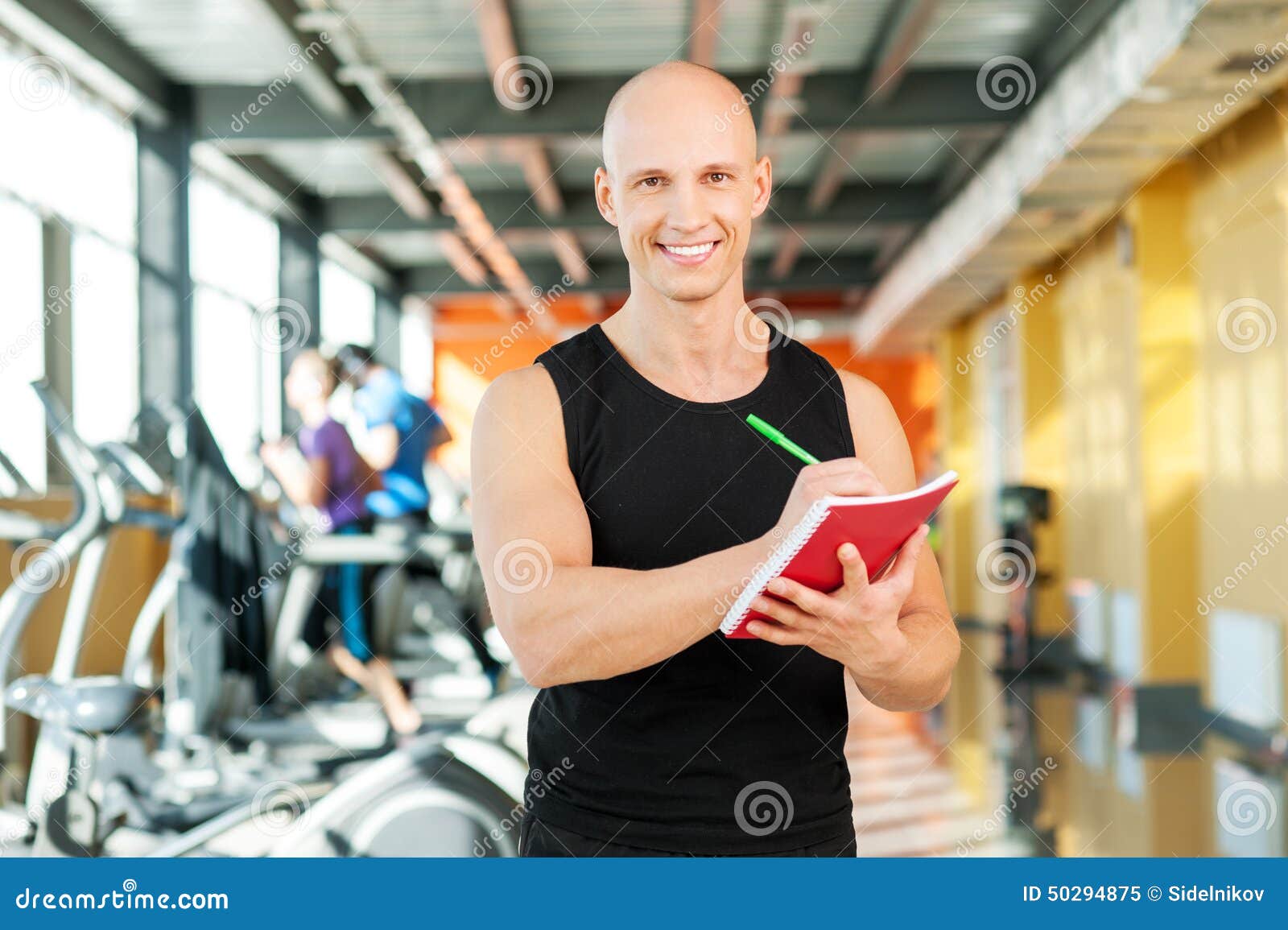 Fitness Instructor Writing Notes in Notebook Stock Image - Image of ...