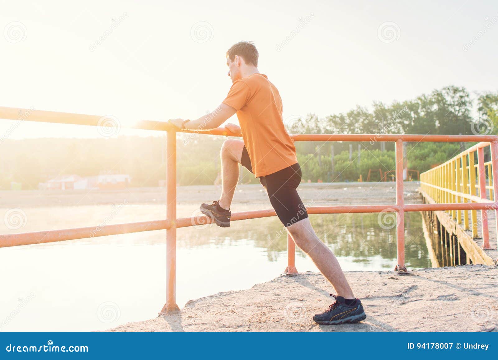 Fitness Man Stretching His Leg Muscles Outdoors. Stock Image - Image of ...